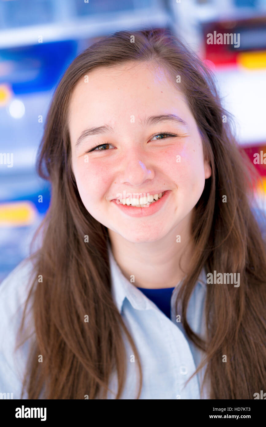 MODEL RELEASED. Portrait of girl with long brown hair, smiling Stock ...
