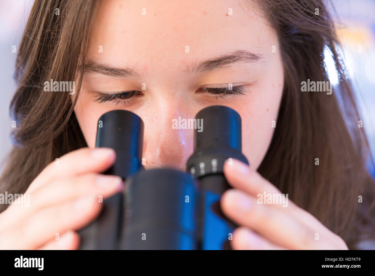 MODEL RELEASED. Girl using microscope, portrait Stock Photo - Alamy