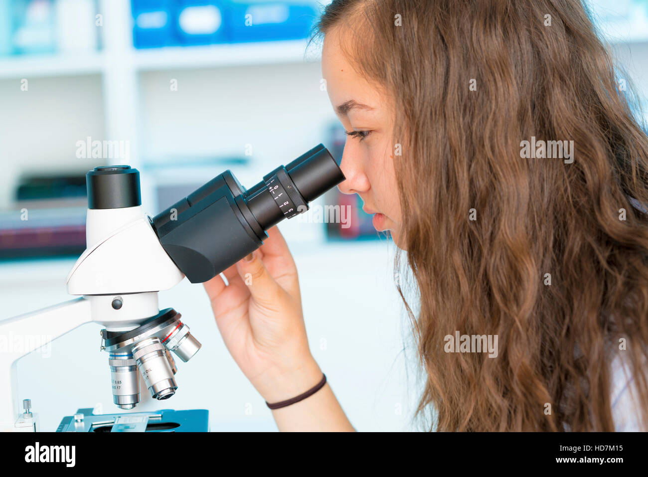 MODEL RELEASED. Girl using microscope, close up Stock Photo - Alamy