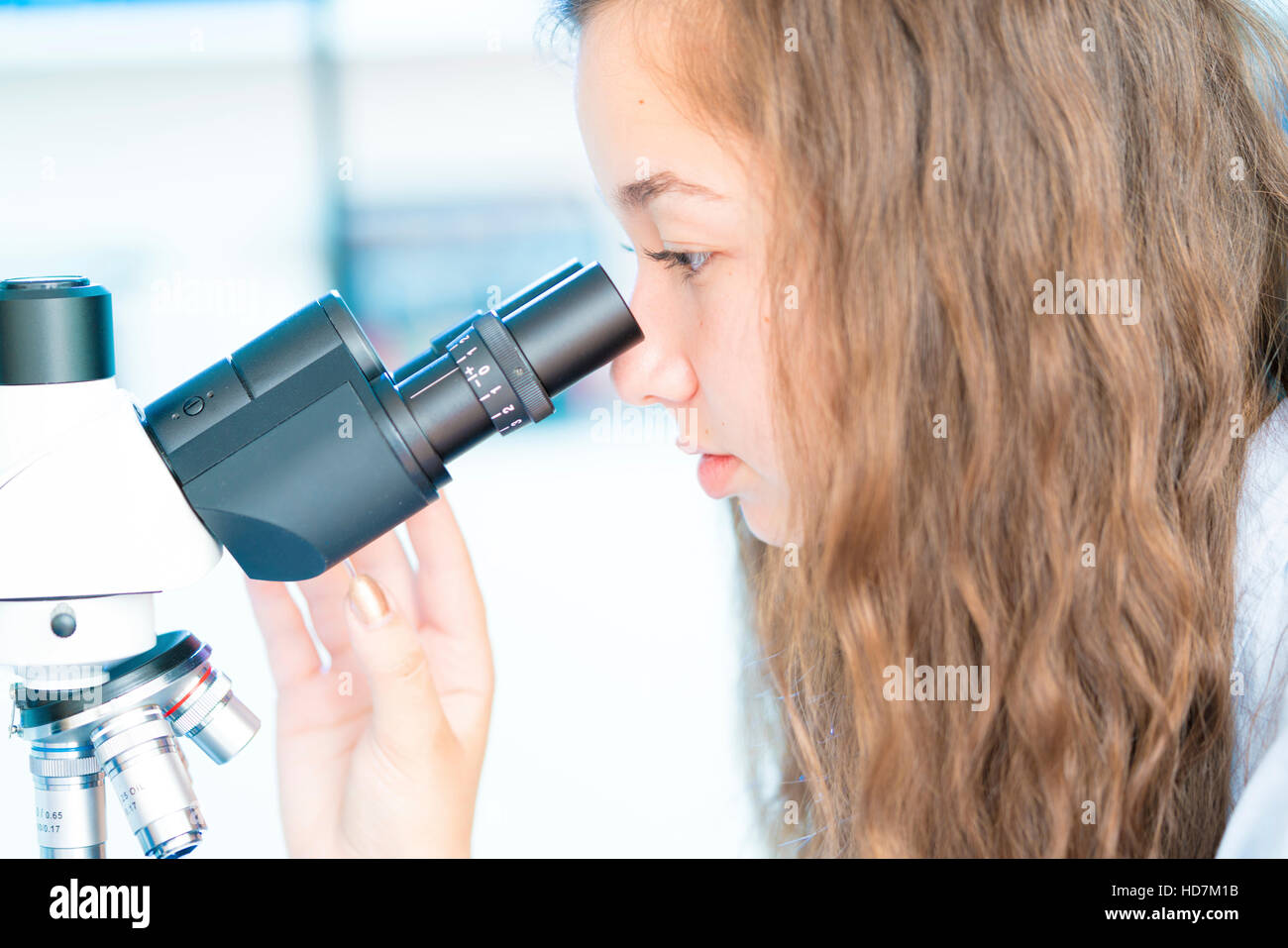 MODEL RELEASED. Girl using microscope, close up Stock Photo - Alamy