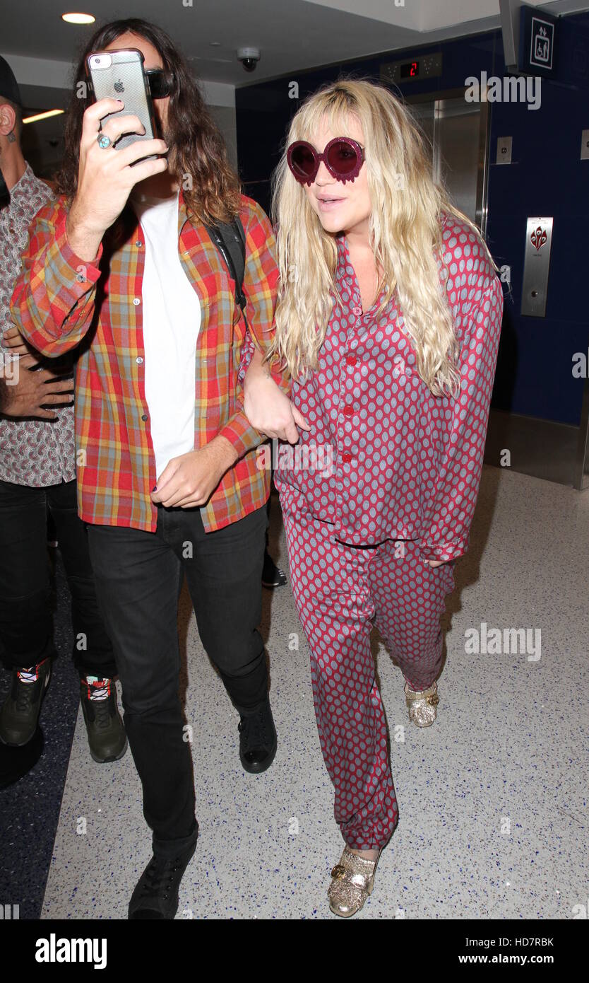 Kesha at Los Angeles International Airport (LAX) with her boyfriend ...