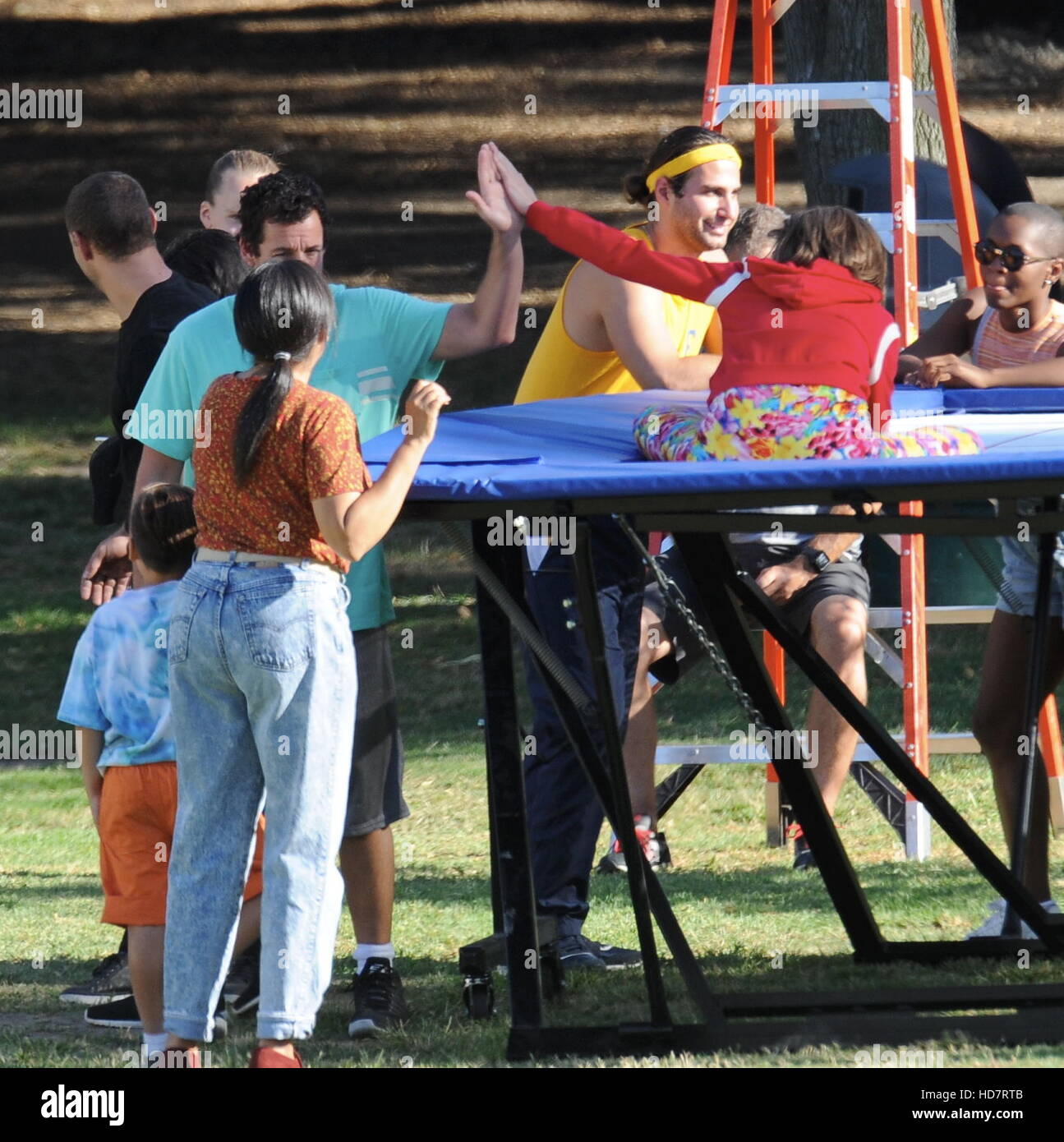 Adam Sandler gives his wife Jackie Sandler a high five after nailing ...