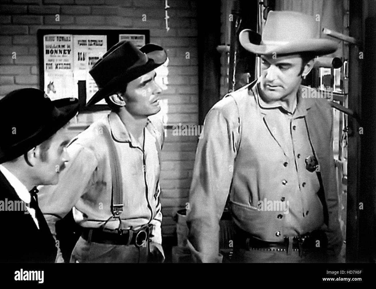 GUNSMOKE, (from left): Milburn Stone, Dennis Weaver, James Arness ...