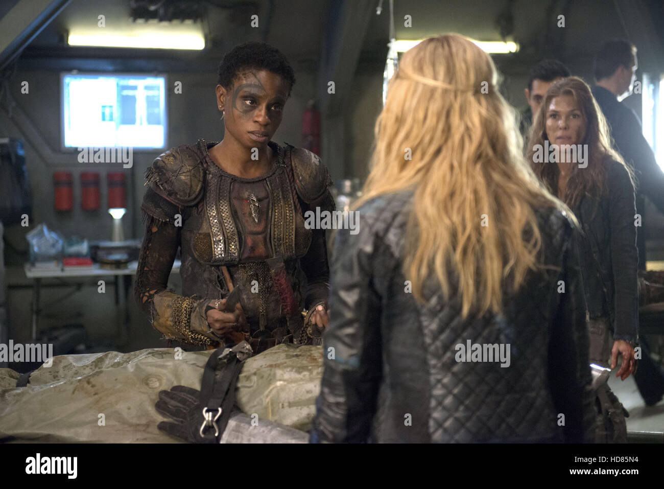 THE 100, (from left): Adina Porter, Eliza Taylor (back to camera ...
