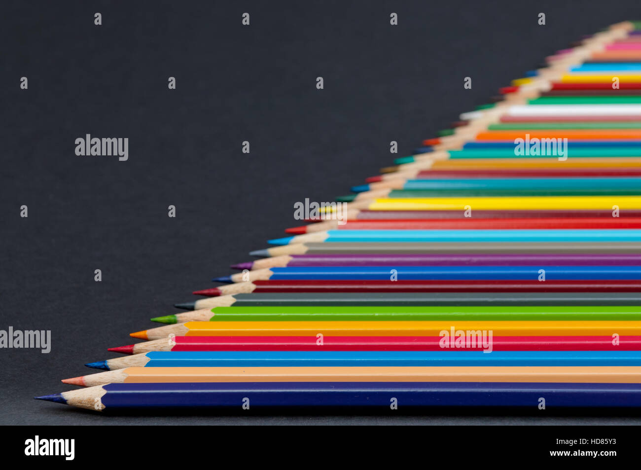 Color pencils isolated on black background Stock Photo - Alamy