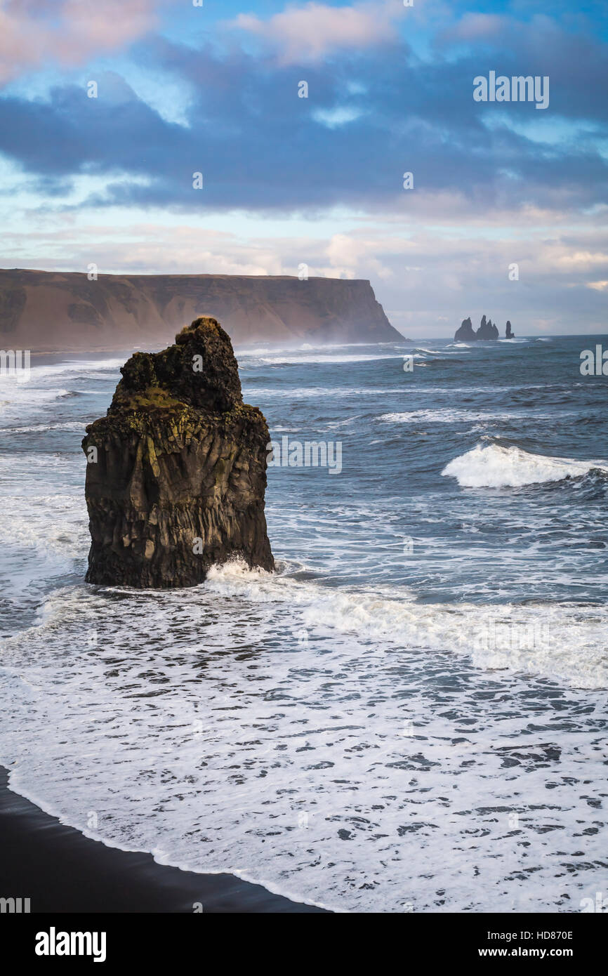 Sea stacks rocks and surf on the Dyrholaey Peninsula coast in southern ...