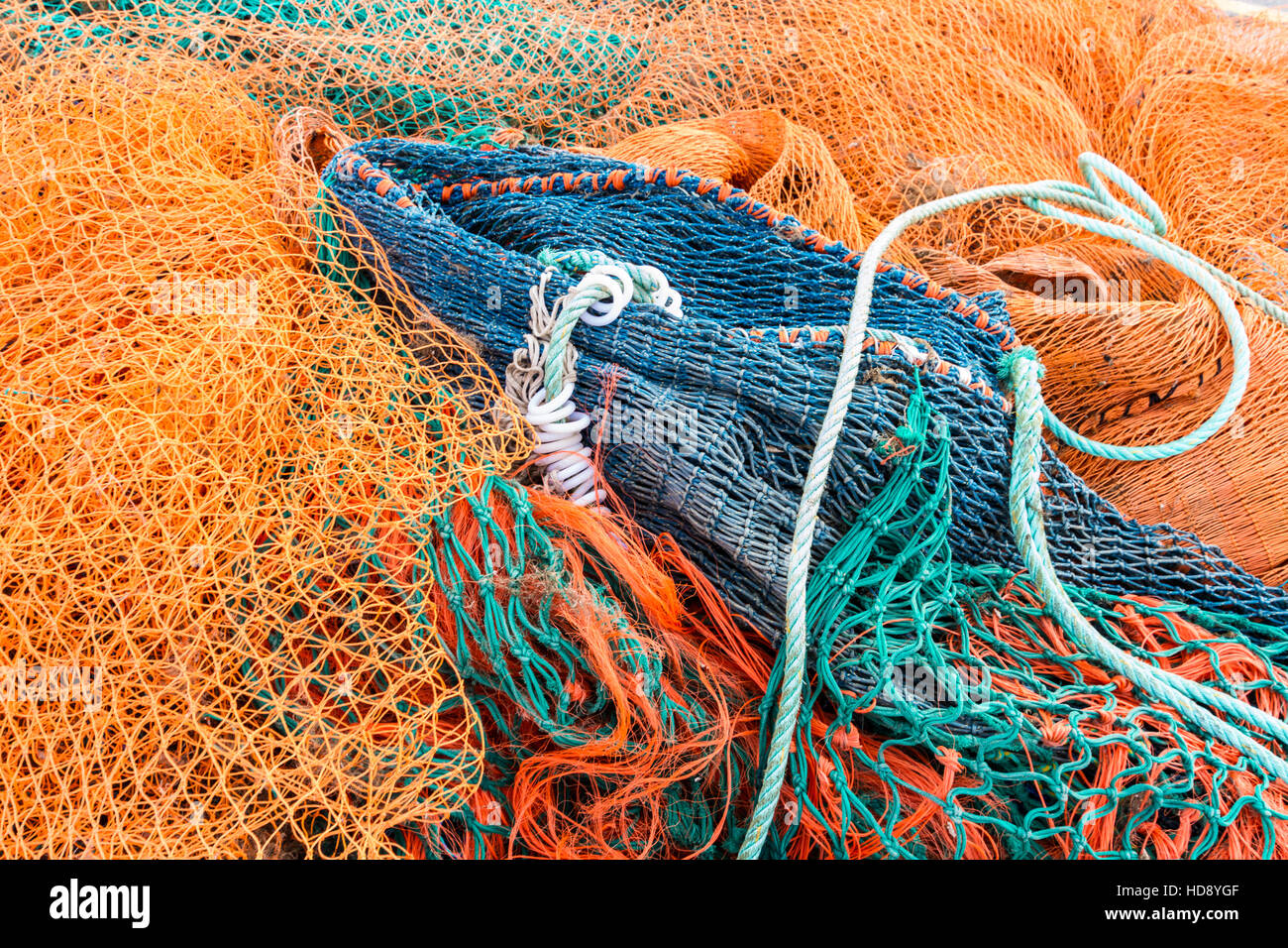 Fishing nets piled together at fishing village Stock Photo - Alamy
