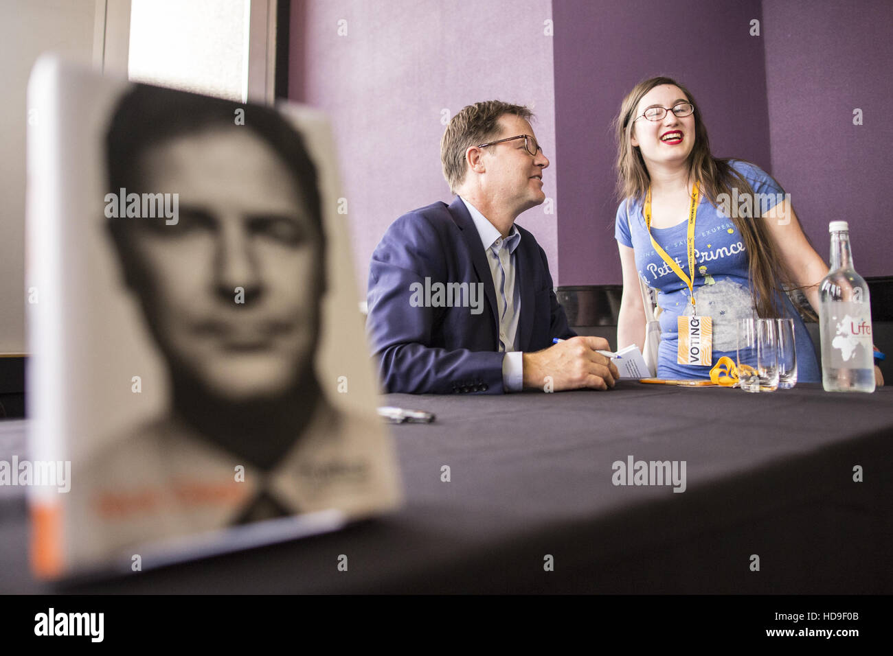 Nick Clegg, former leader of the Liberal Democrats, signing copies of ...