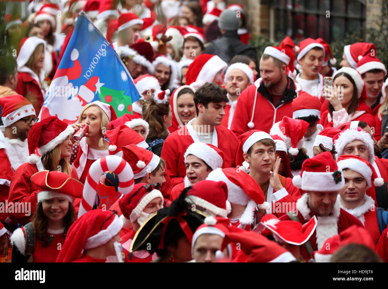 Hundreds of revellers dressed in Santa suits set off from Camden in ...