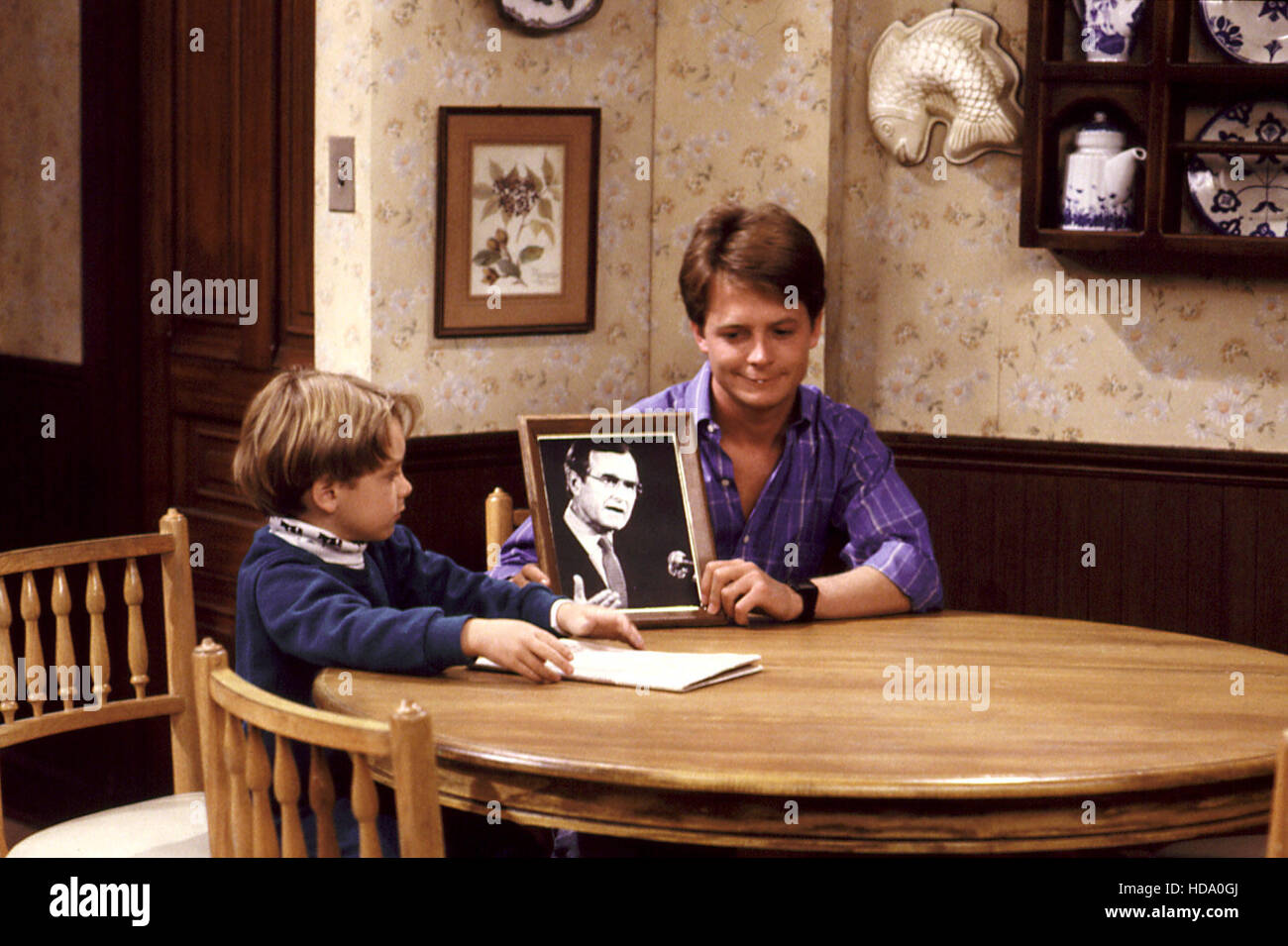 FAMILY TIES, Brian Bonsall, Michael J. Fox, Alex Keaton holds a picture ...