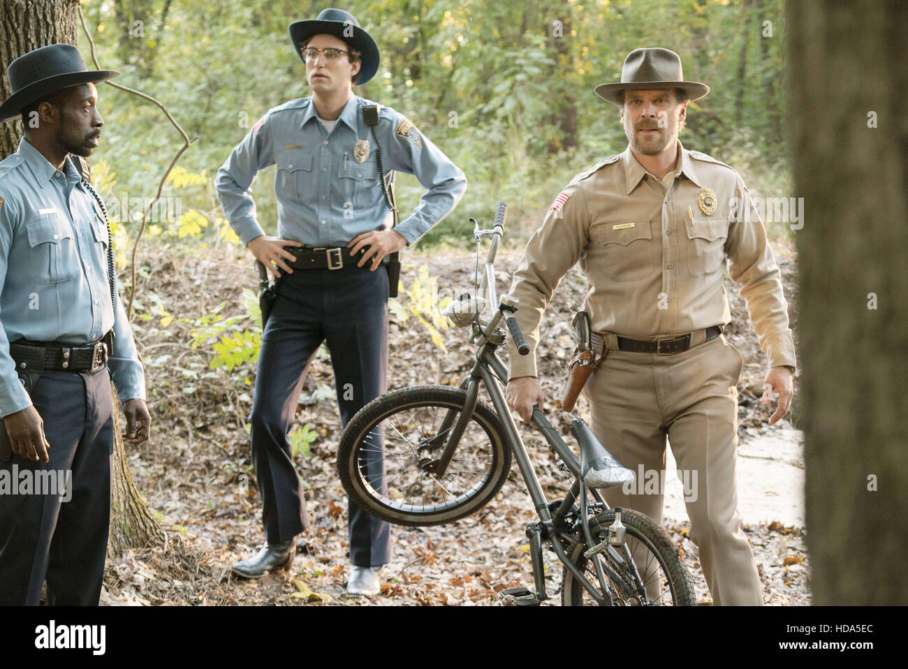 STRANGER THINGS, l-r: Rob Morgan, Stephen Dean, David Harbour in ...