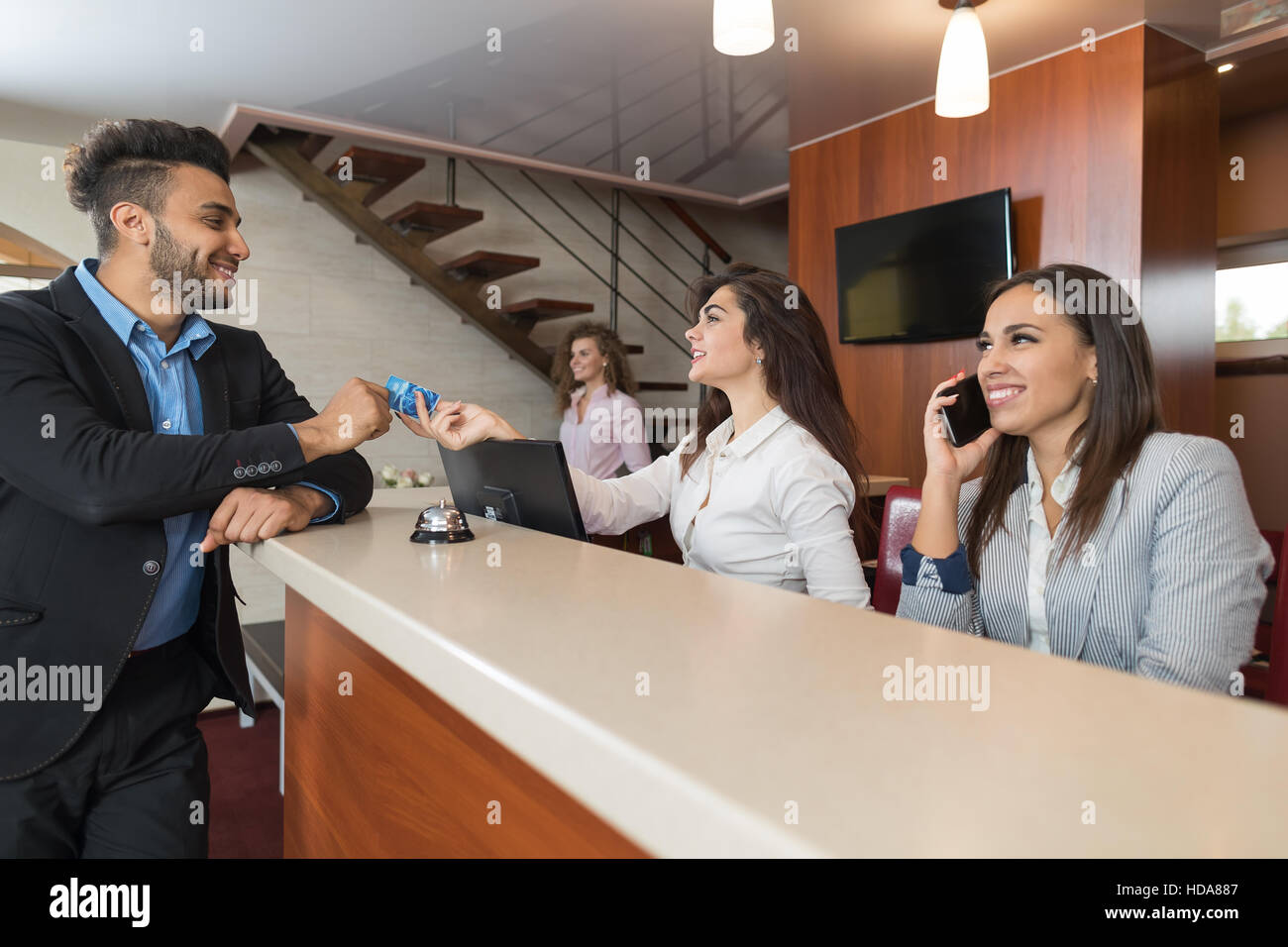 Man arriving at registration desk hi-res stock photography and images ...