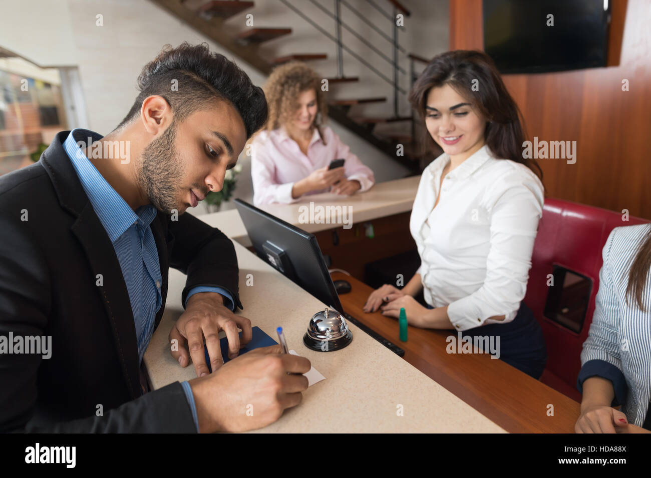 Business Man Arriving To Hotel Singing Document Meeting Woman ...