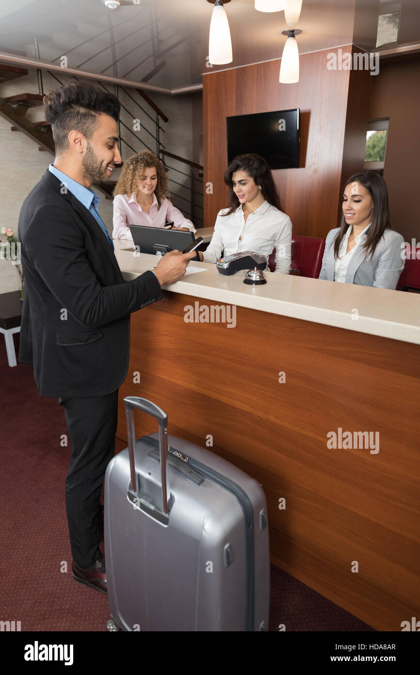 Business Man Arrive To Hotel Check In With Cell Phone Woman ...