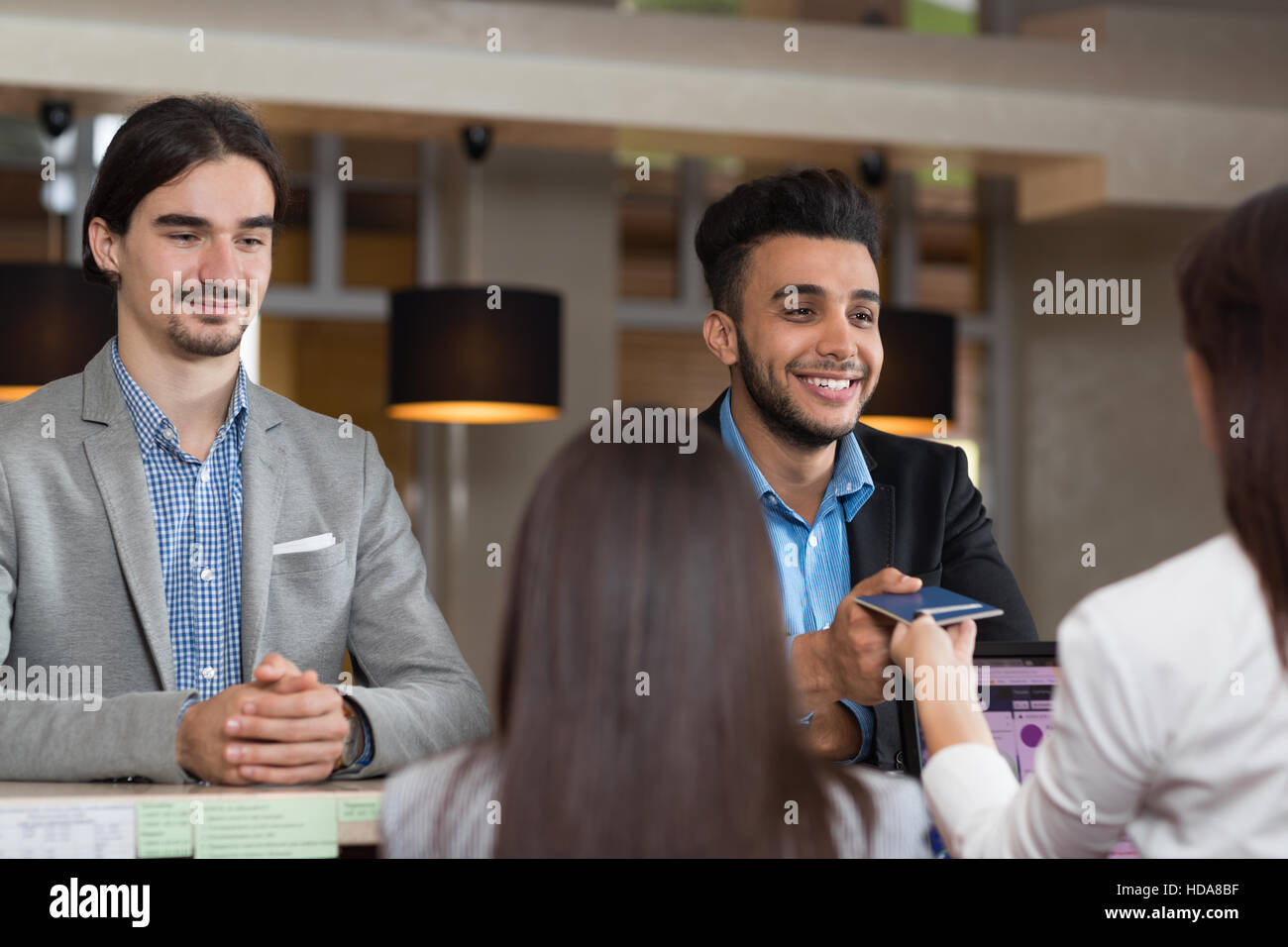 Two Business Man Arriving To Hotel Give Passport Meeting Woman ...