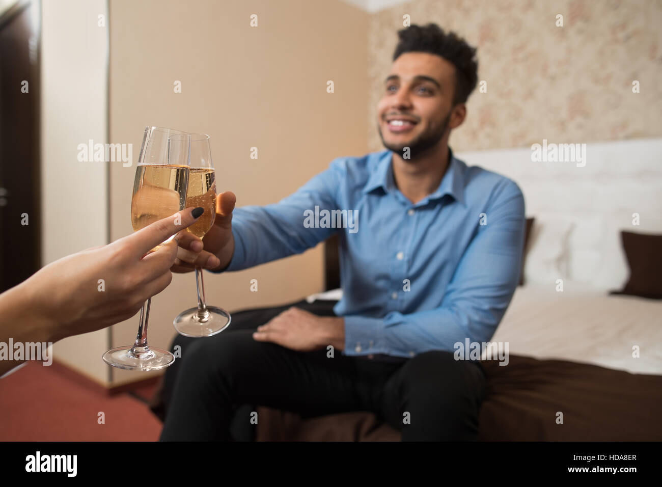 Latin Businessman Clink Champange Glass Cheers Sitting At Bed Room With ...