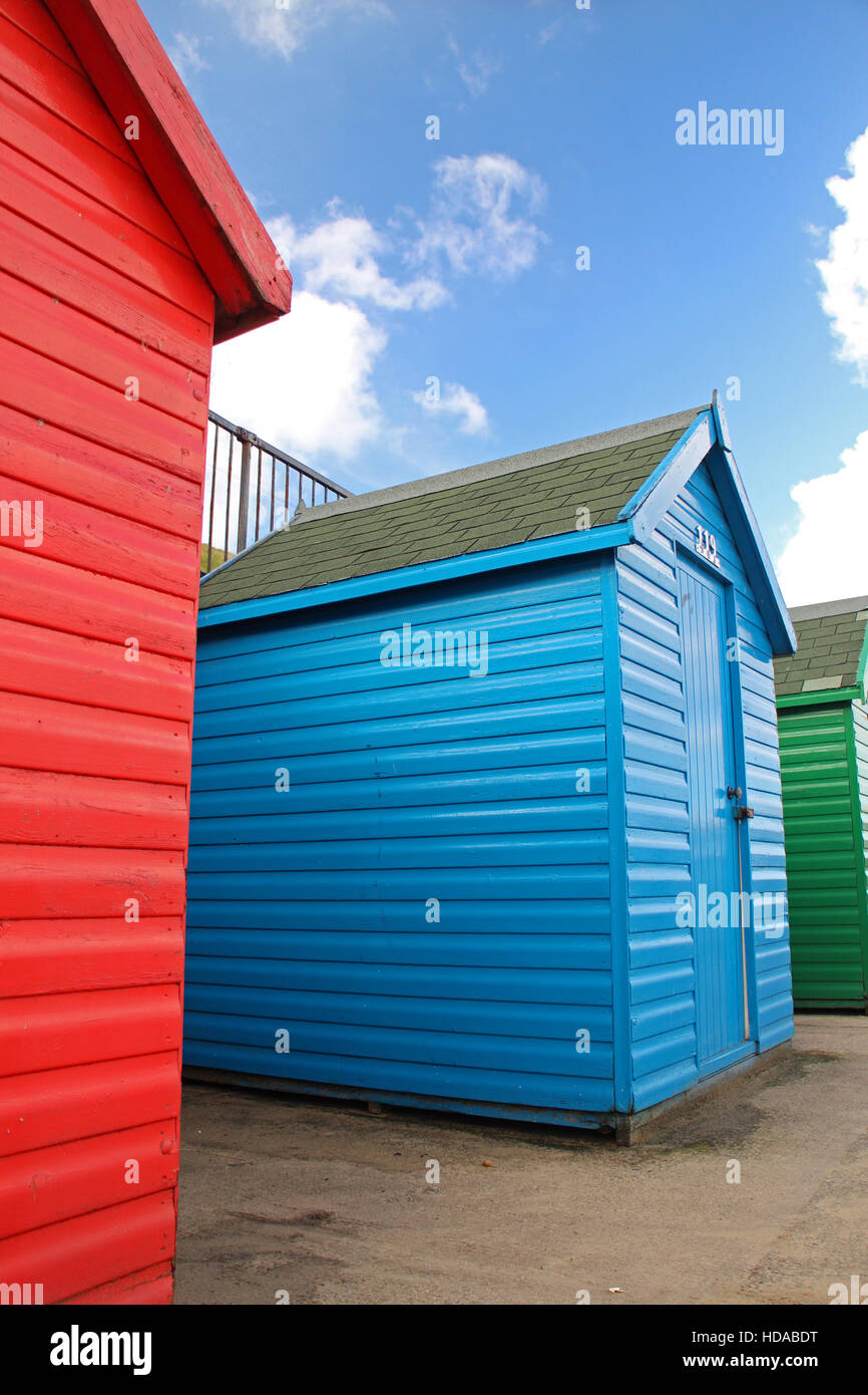 Coloured beach huts on Whitby promenade Stock Photo - Alamy