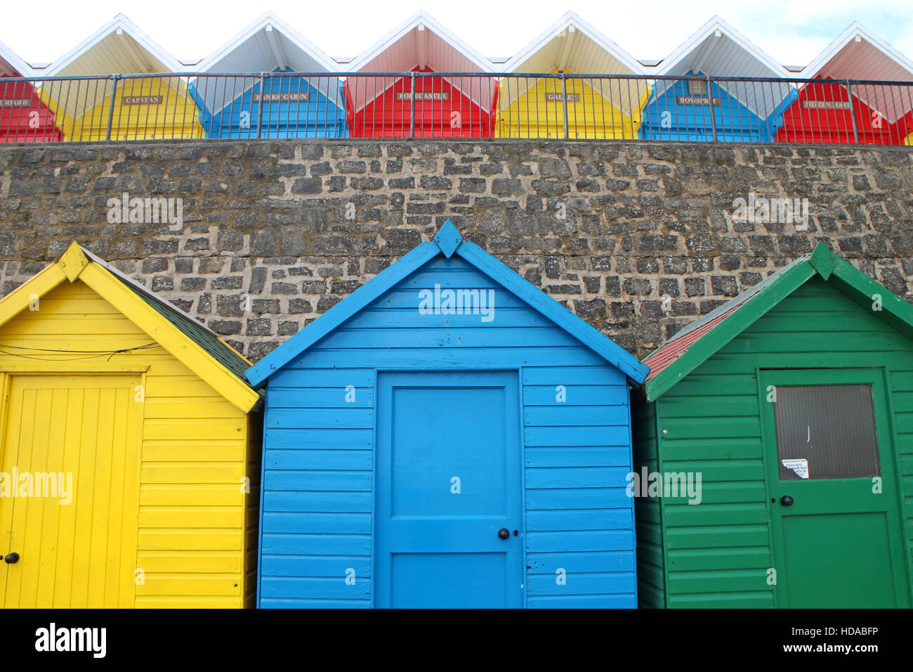 Coloured beach huts on Whitby promenade Stock Photo - Alamy