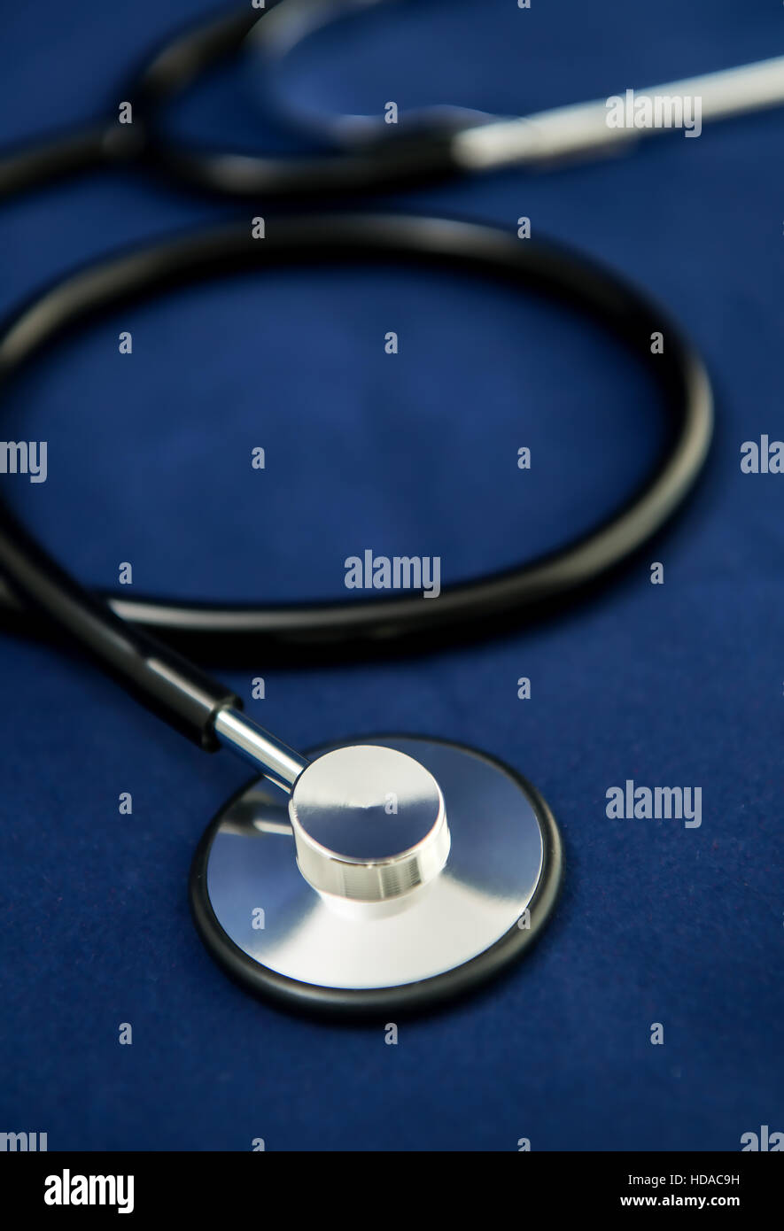 Stethoscope on dark blue background Stock Photo - Alamy