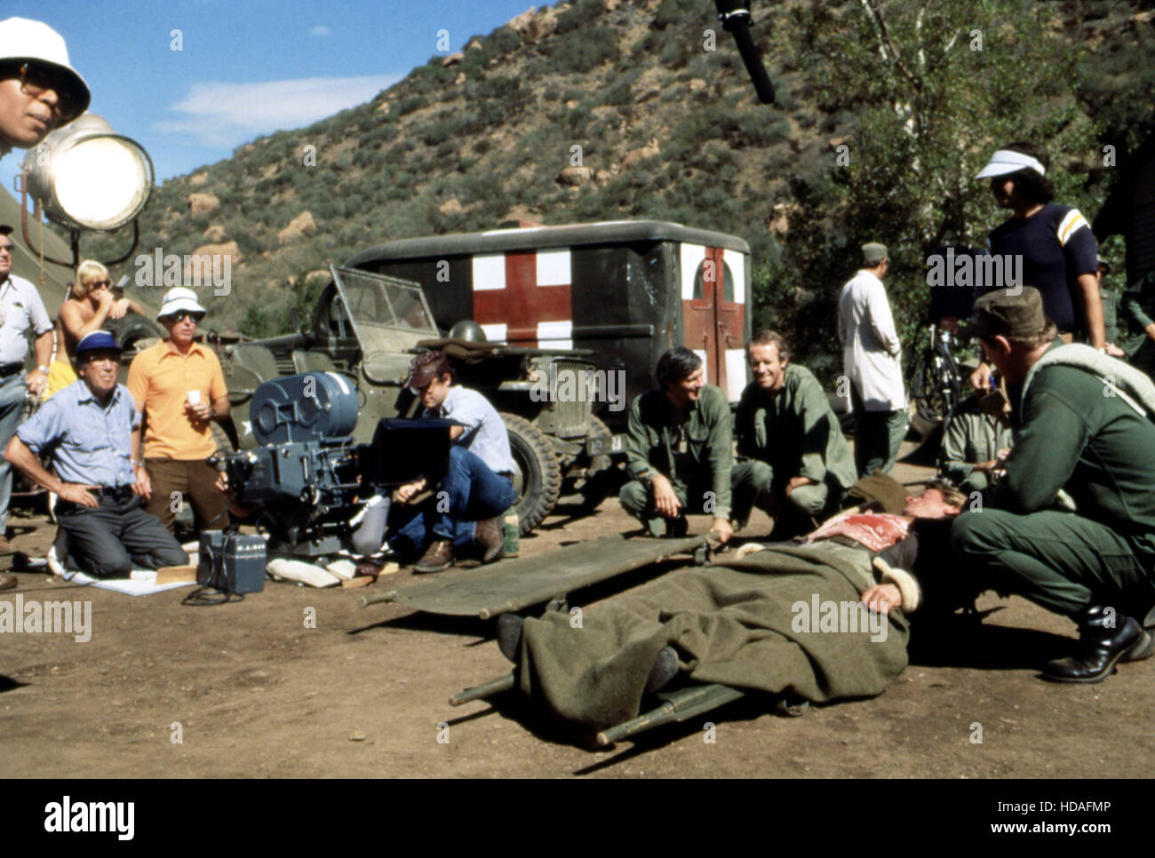 MASH, (aka M*A*S*H), front right: Alan Alda, Mike Farrell in production ...