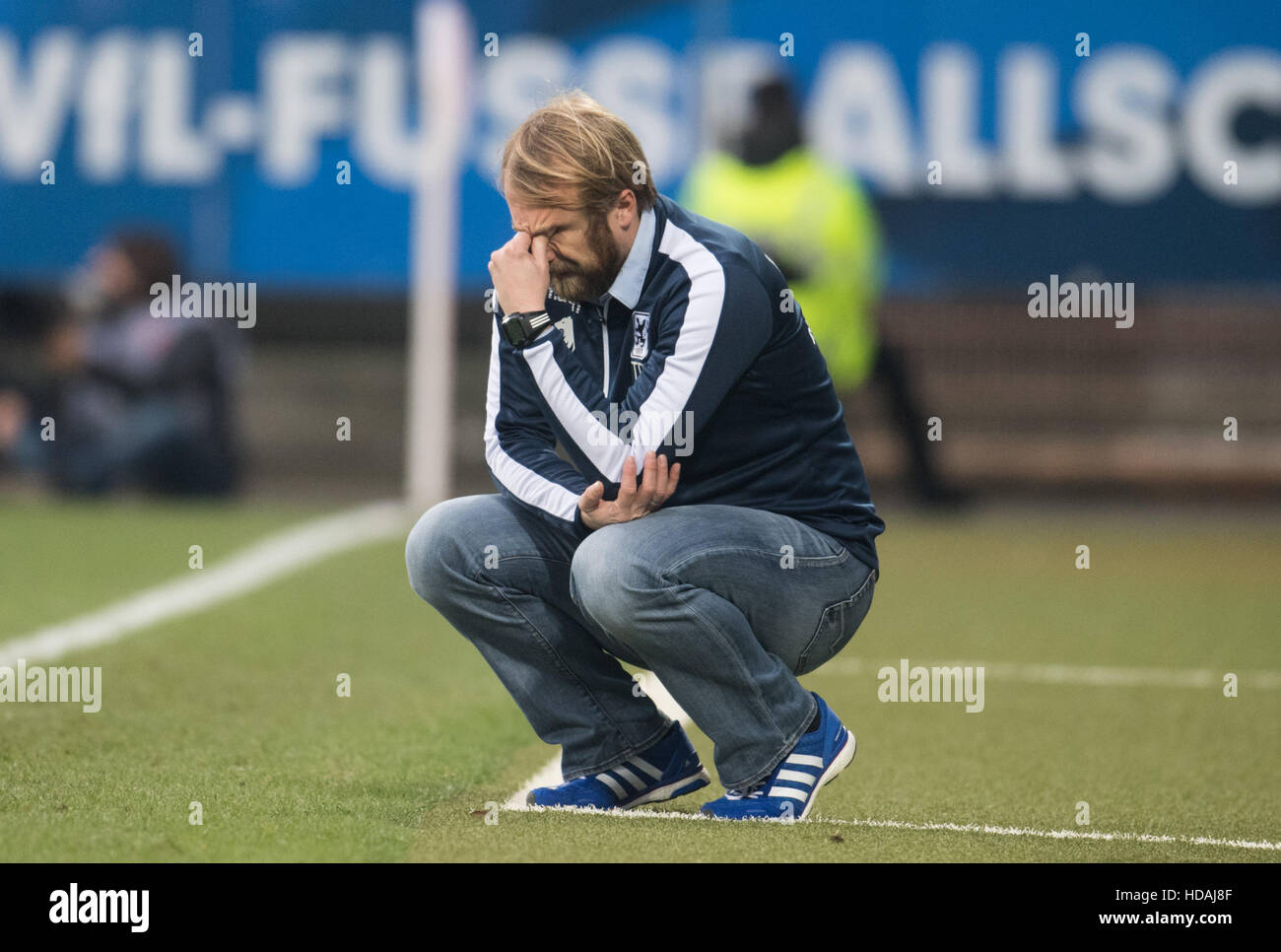 Bochum, Germany. 10th Dec, 2016. Munich's coach Daniel Bierofka kneels ...