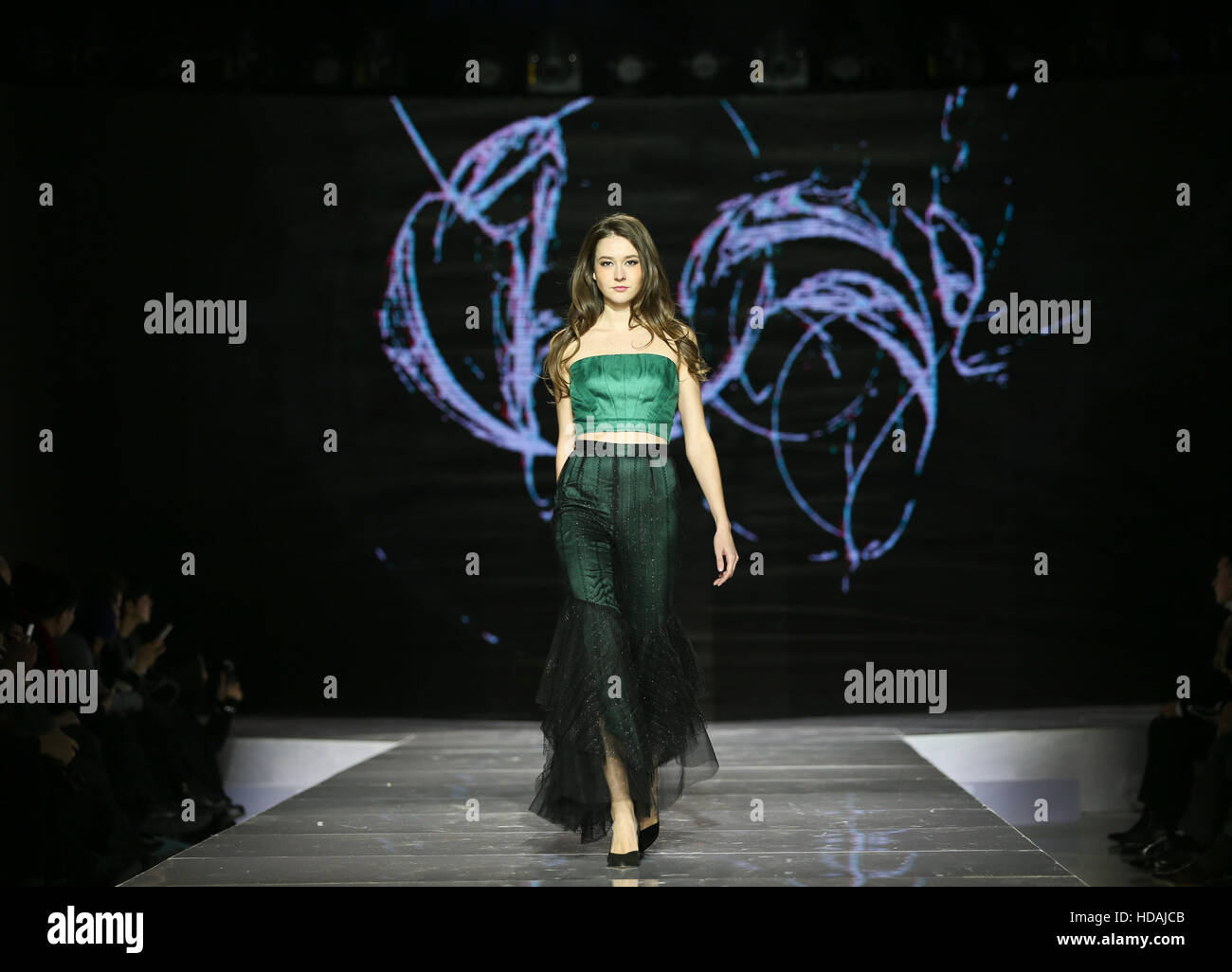 Beijing, China. 10th Dec, 2016. A model displays a creation of Grace ...