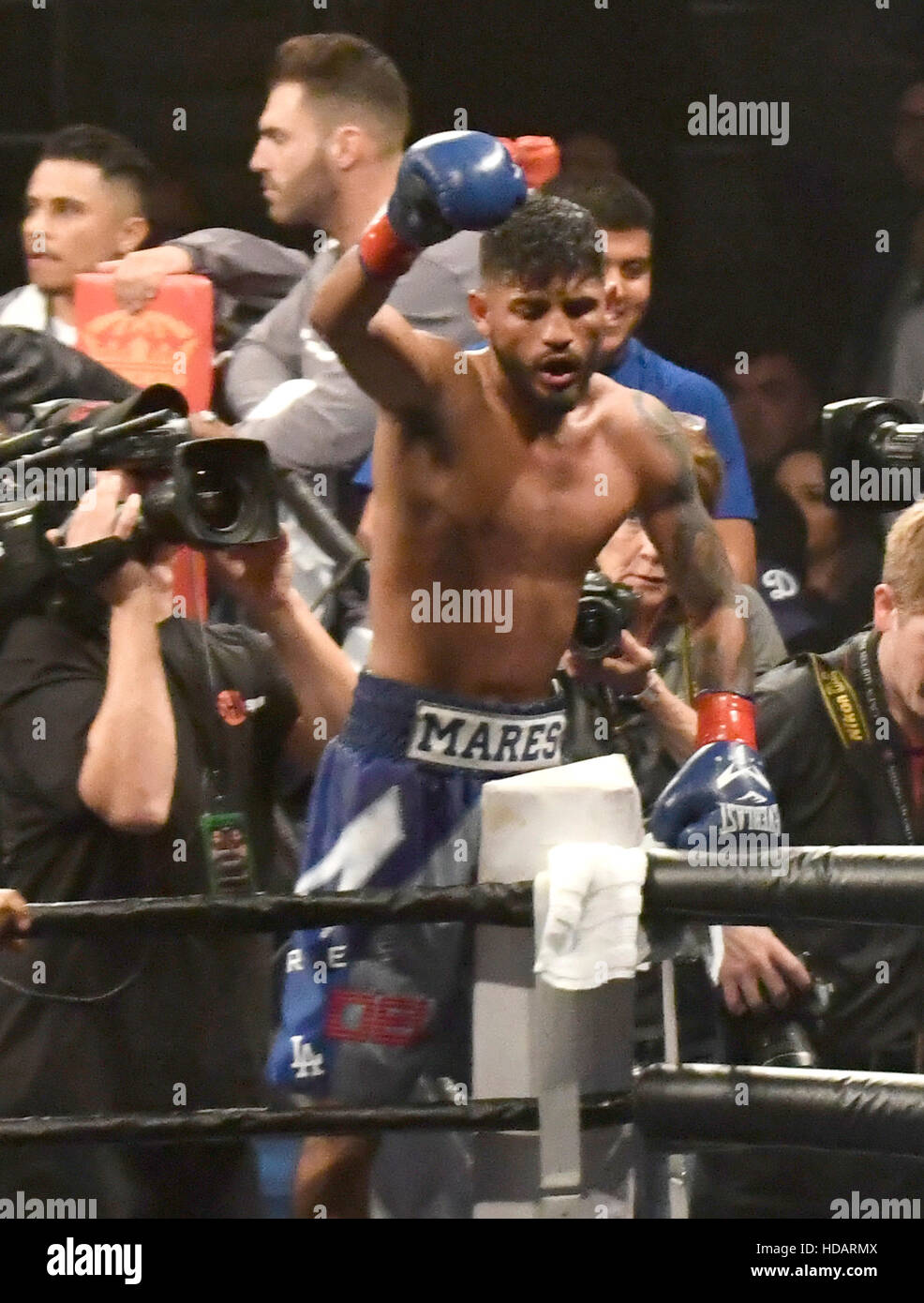 Abner Mares waves to his fans at the end of the12th round with Jesus ...