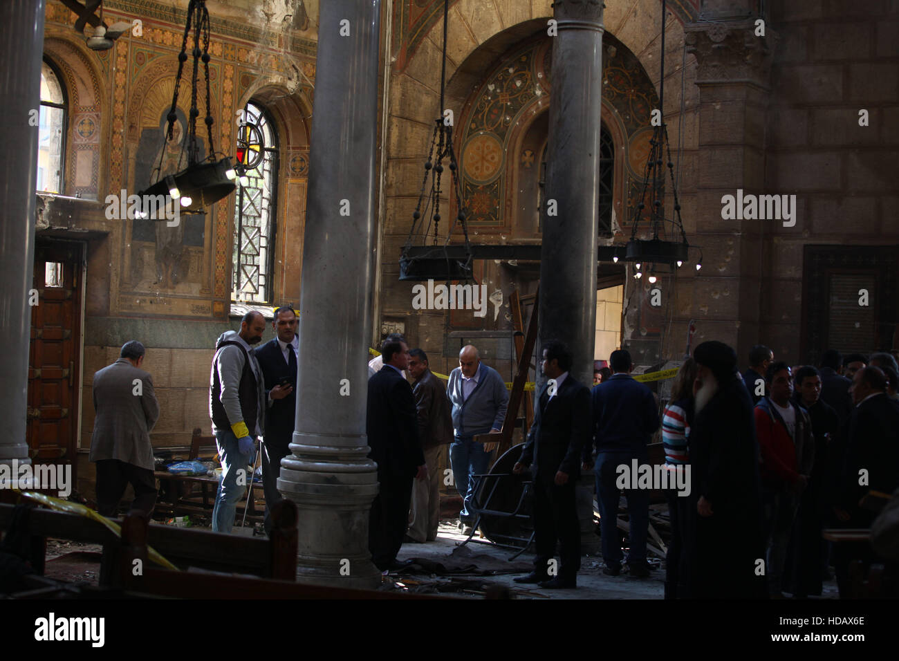 Cairo. 11th Dec, 2016. Egyptian policemen inspect the explosion site in ...