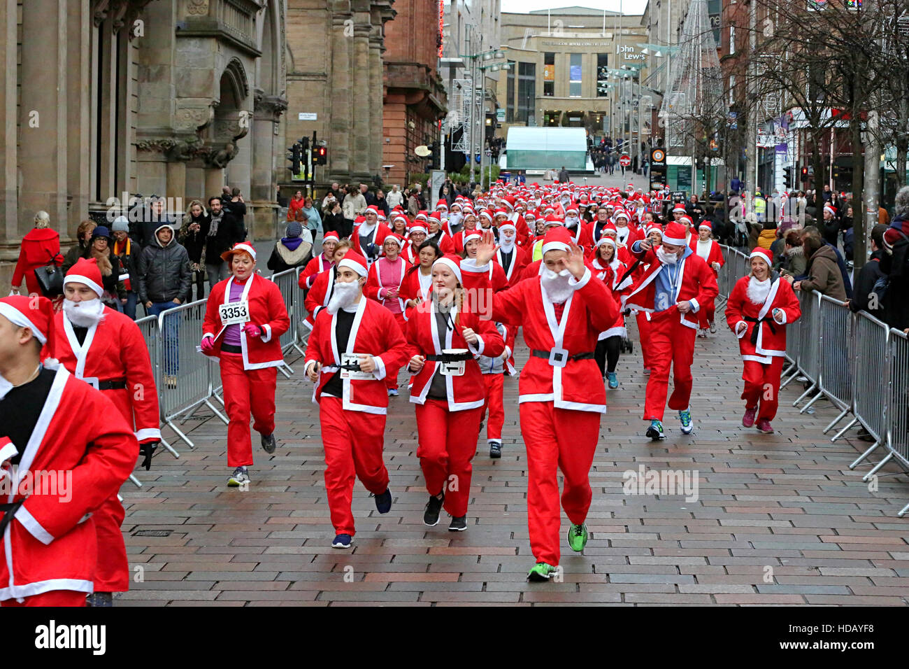 Thousands participate in Glasgow's 2016 Santa Dash fun run Stock Photo ...