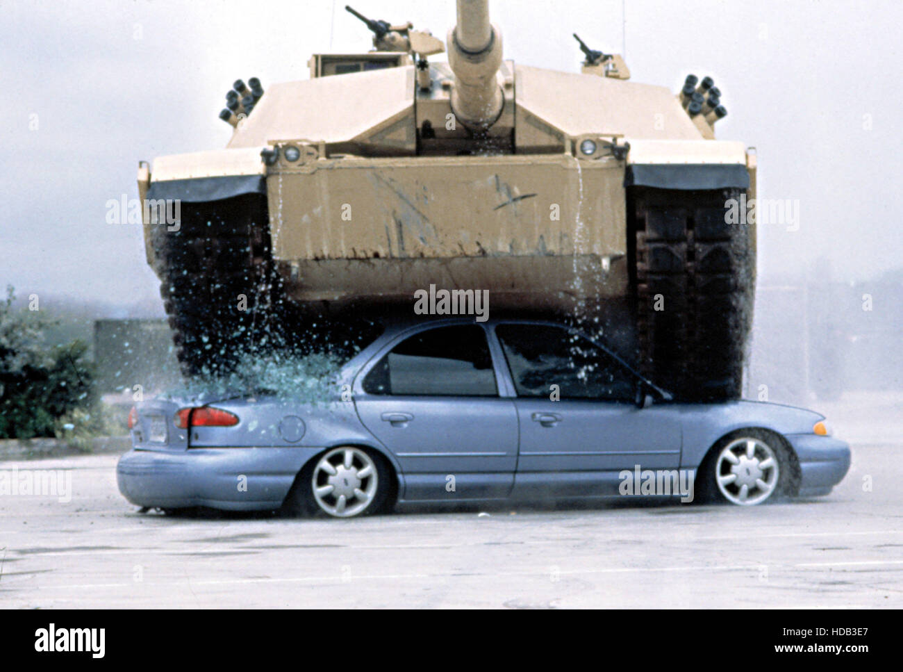 JAG, a military tank crushing a car, 1995 Stock Photo - Alamy