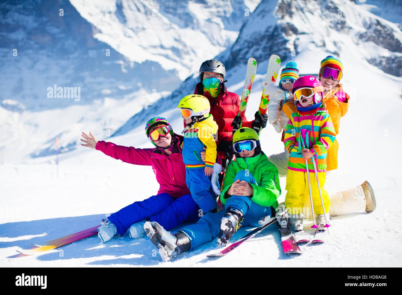 Family ski vacation. Group of skiers in Swiss Alps mountains. Adults ...