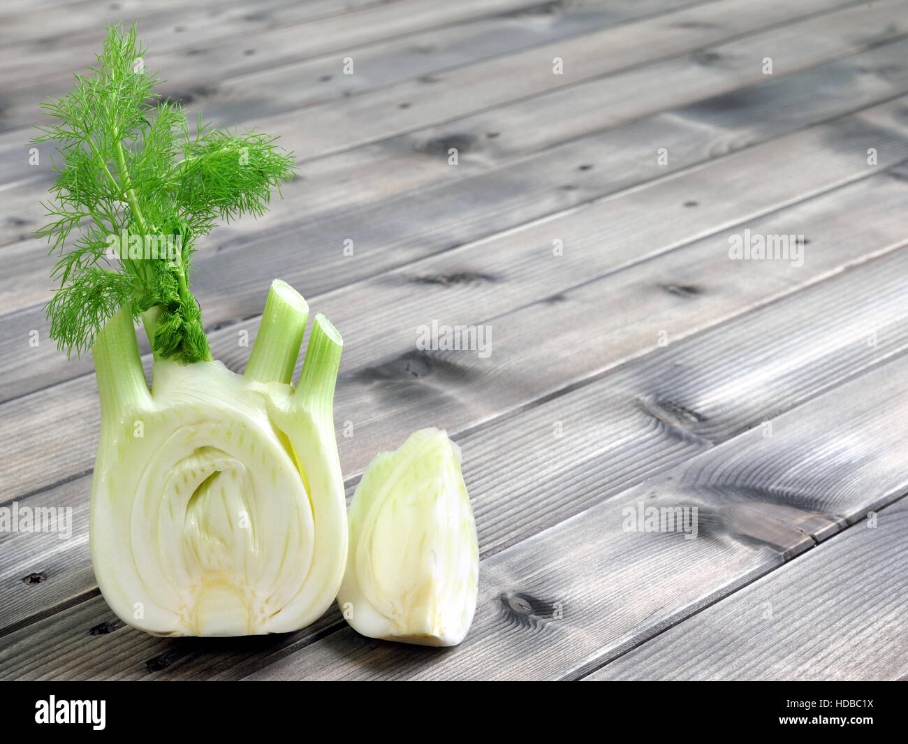 Fresh fennel cut just harvested, photographed on wooden table Stock ...