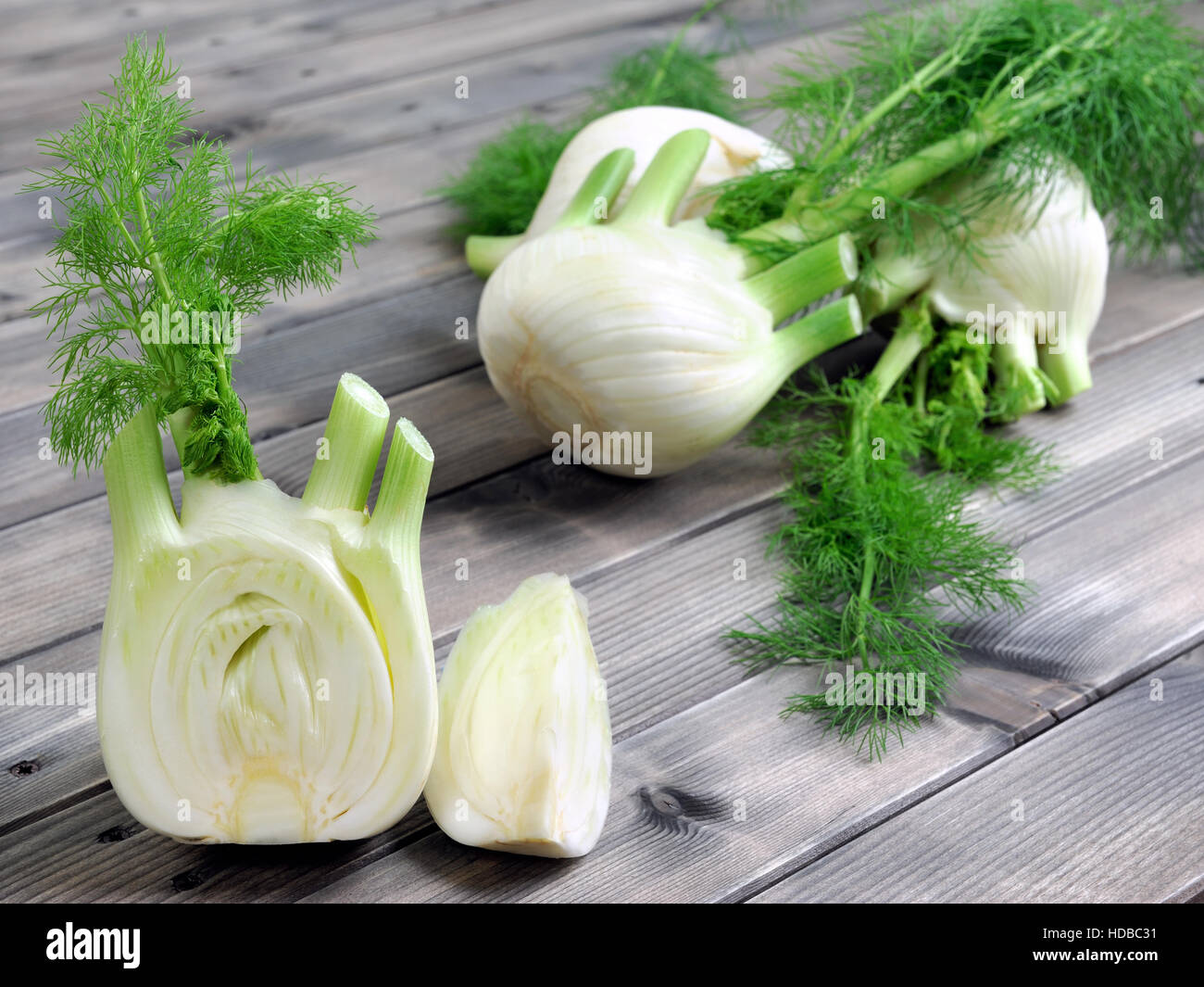 Fresh fennel cut just harvested, photographed on wooden table Stock ...