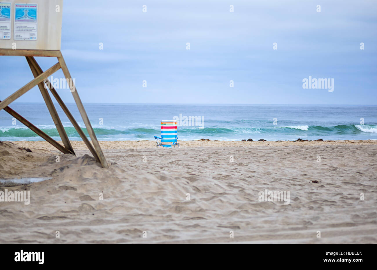 Lifeguard tower and beach chair, coastal scene Stock Photo - Alamy