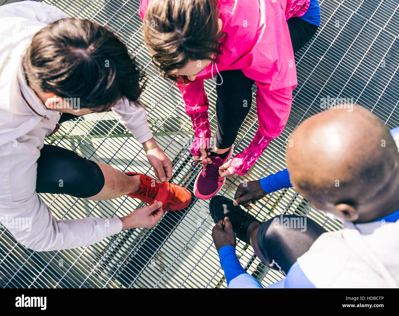 Multiethnic group of runners getting ready for a workout session ...