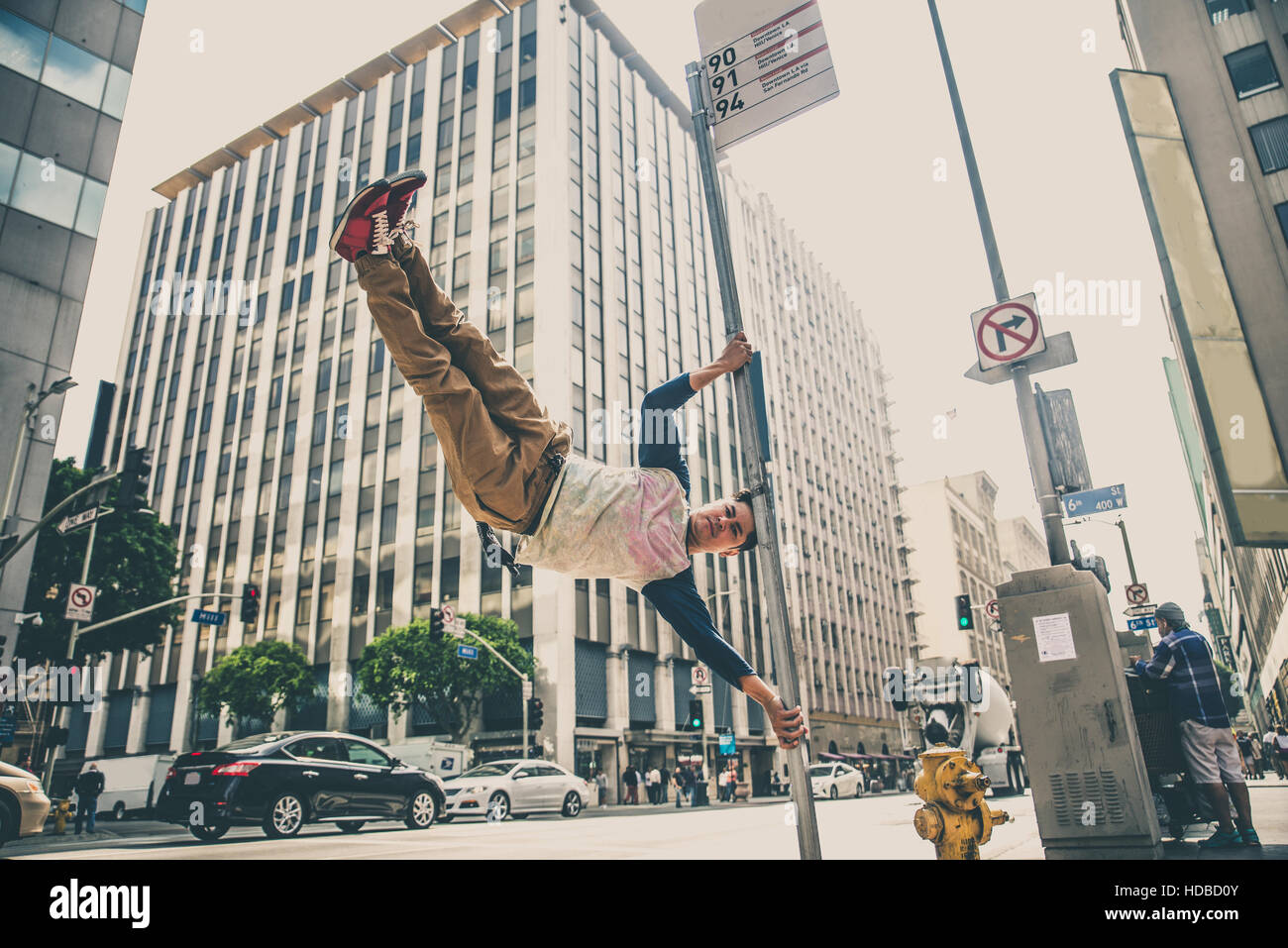 Parkour man doing tricks on the street - Free runner training his ...