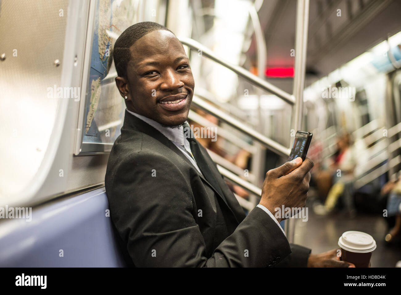 Businessman in full suit in New York subway metro Stock Photo - Alamy