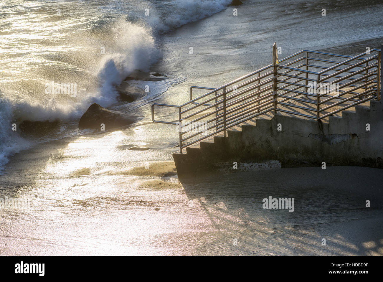 stairs leading down to a beach with breaking waves Stock Photo - Alamy