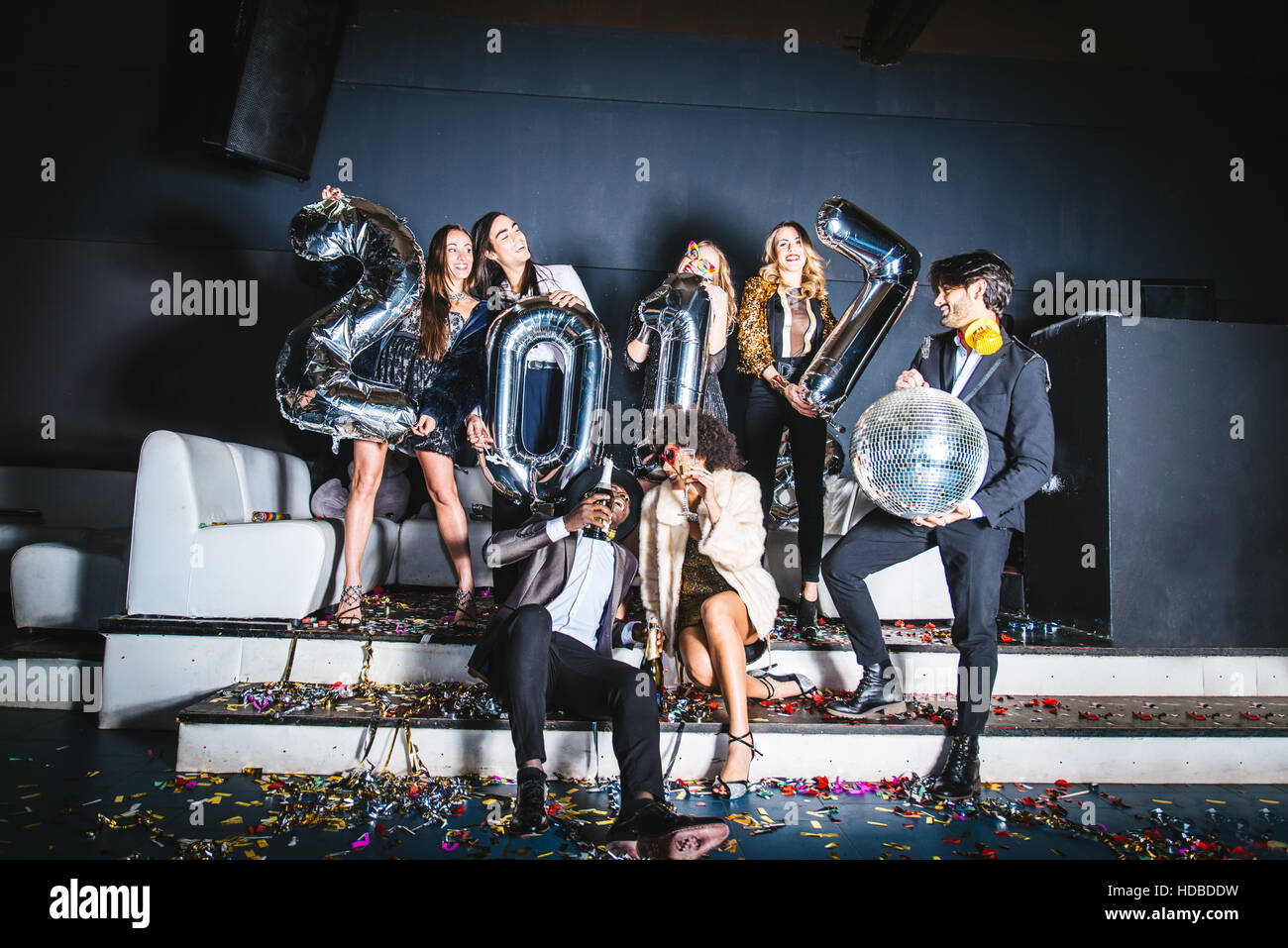 Multi-ethnic group of friends celebrating the end of the year in a ...