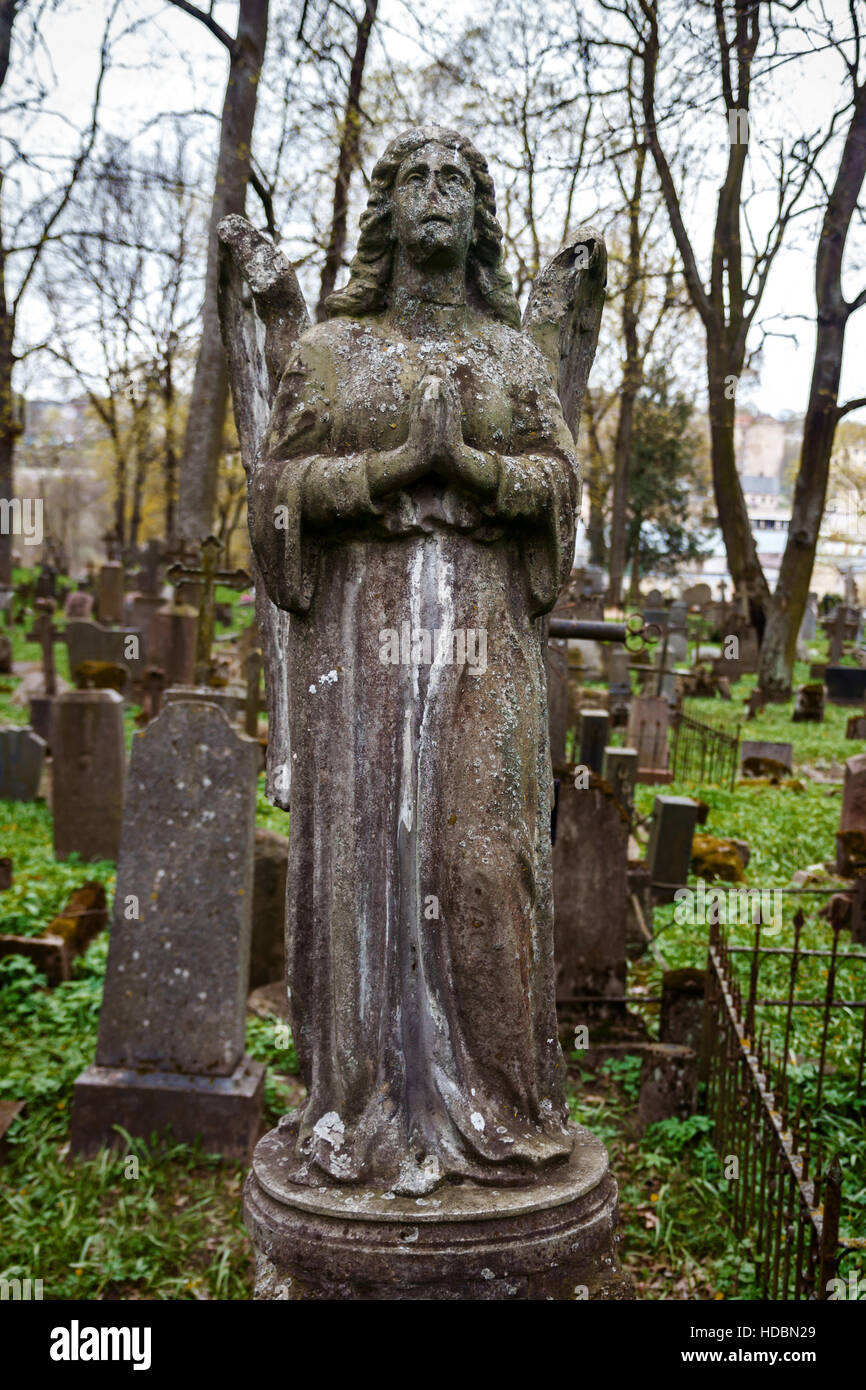 Old statue of an angel at Vilnius cemetery Stock Photo - Alamy