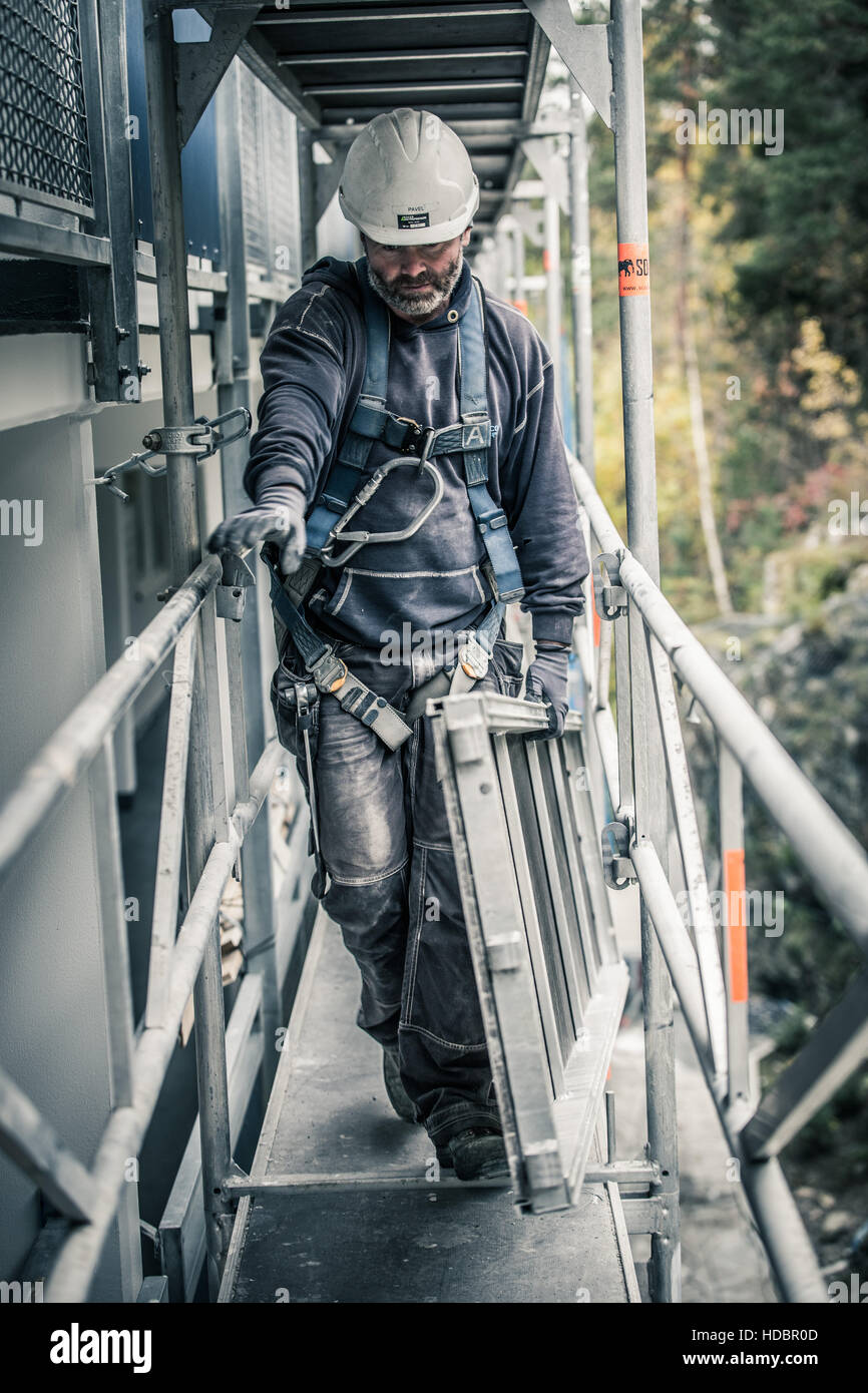 Scaffolder at work Stock Photo - Alamy