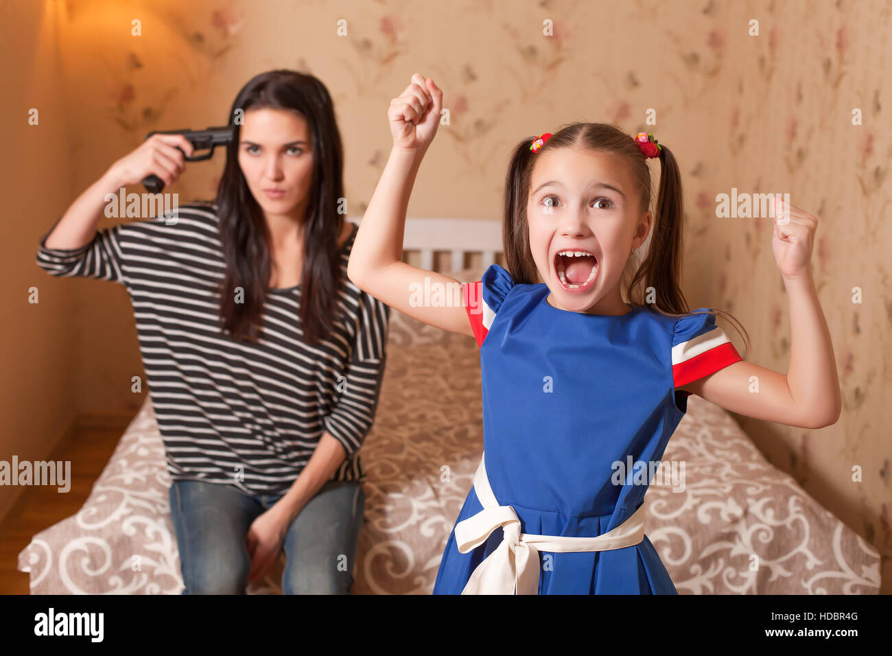 Crazy little girl fool around Stock Photo - Alamy