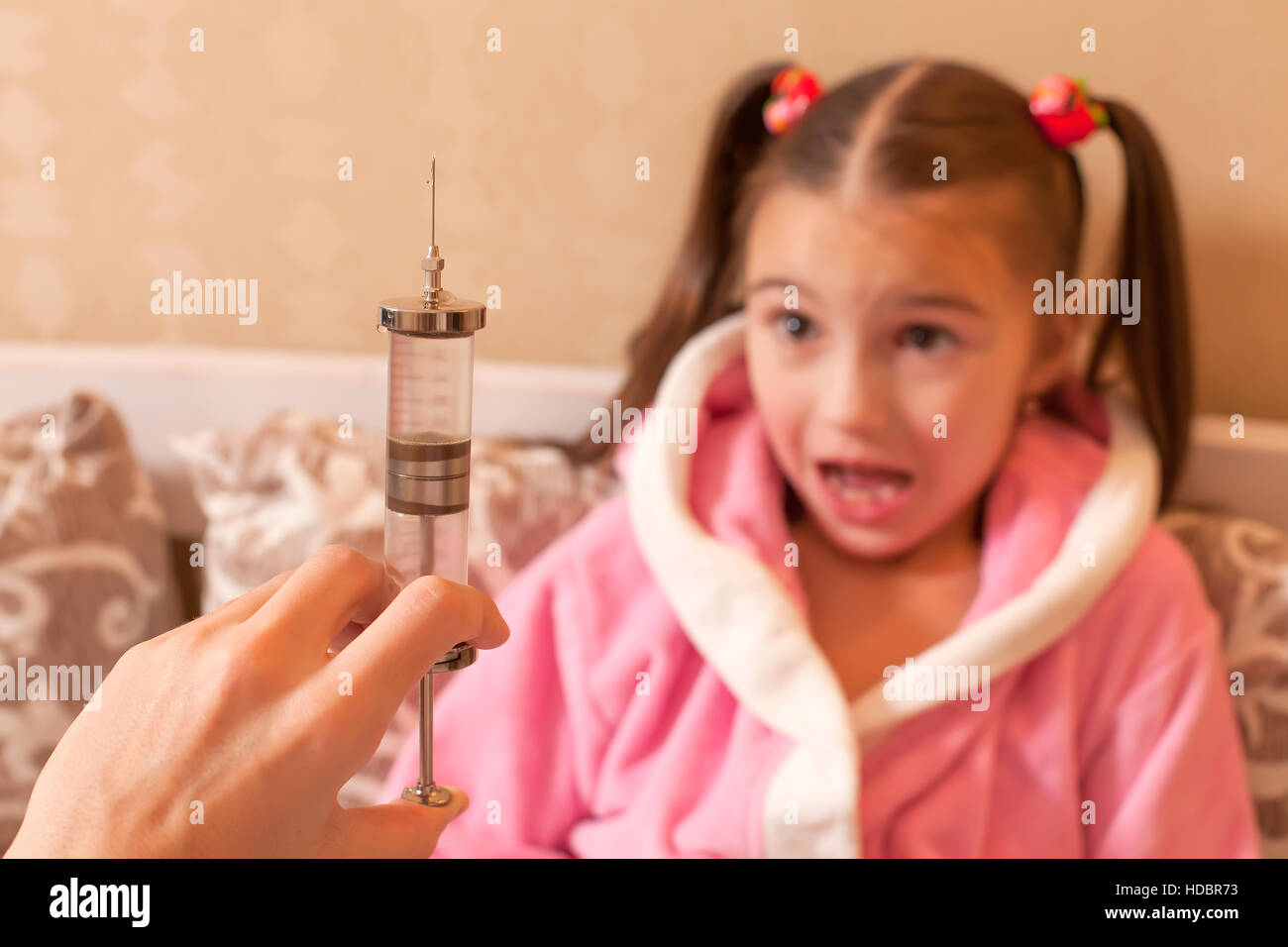 Closeup doctors hand with the syringe Stock Photo - Alamy