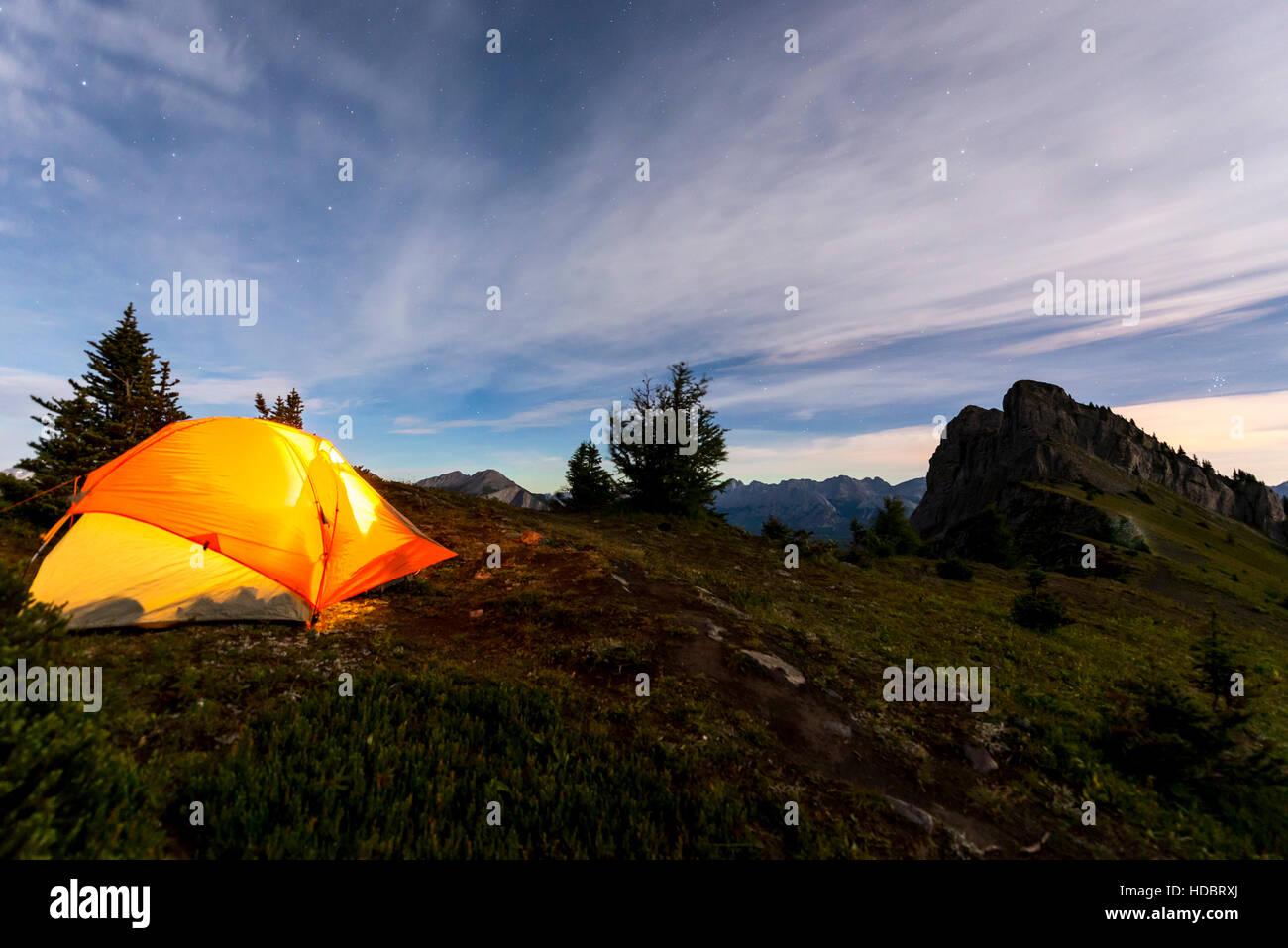 Illuminated tent camping on ridgeline of mountain Stock Photo - Alamy