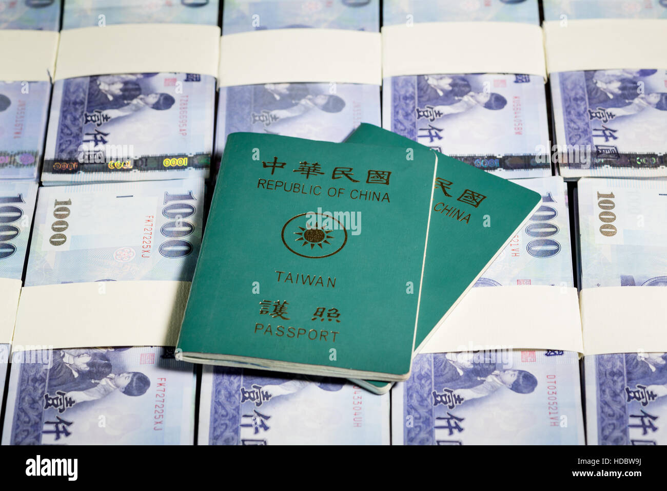 NT dollars in stacks with ROC passport Stock Photo - Alamy