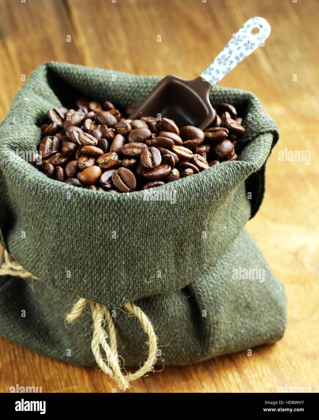 Natural organic coffee beans on a wooden background Stock Photo - Alamy
