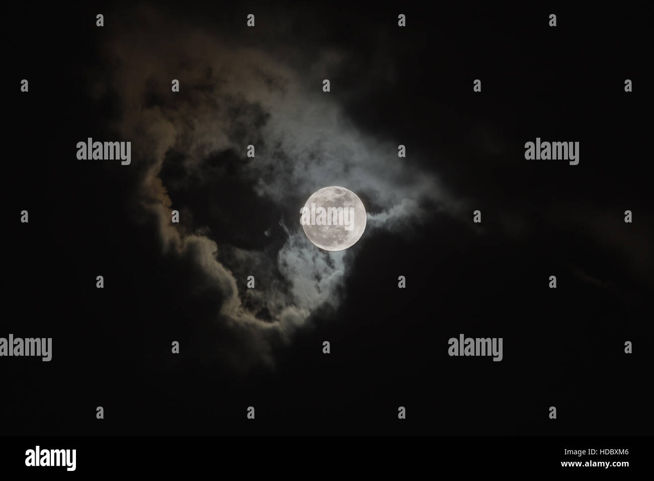 Bright full moon on cloudy scene of night sky. Elements of this image ...