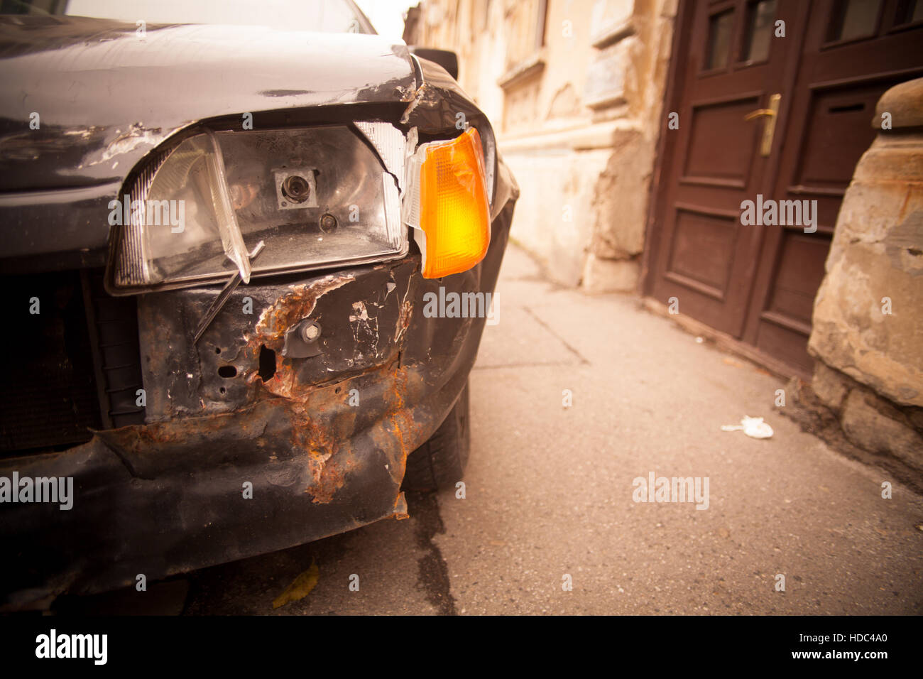 Color image of a crashed car with broken headlight Stock Photo - Alamy