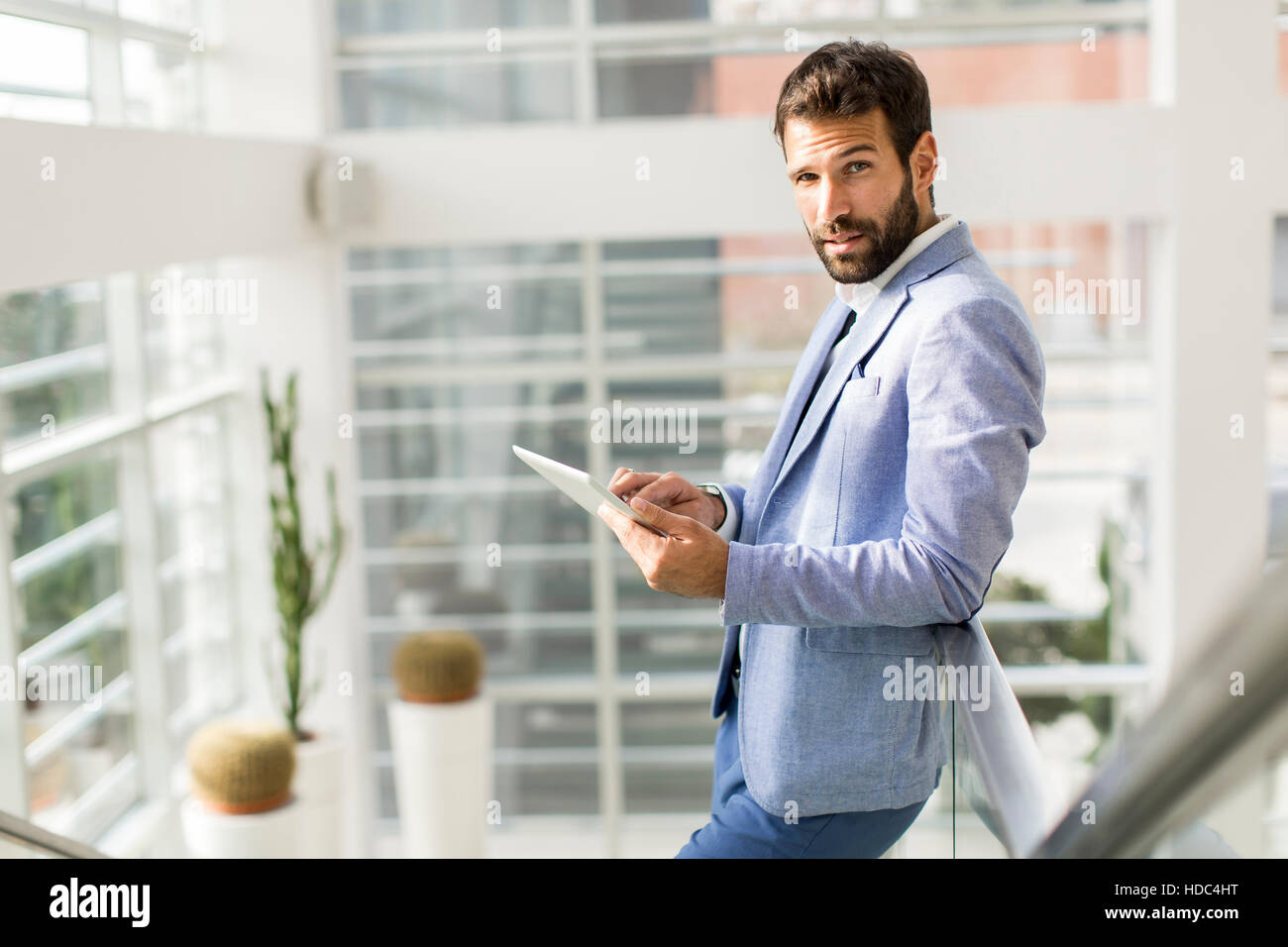 View at Businessman using his digital tablet at the office Stock Photo ...