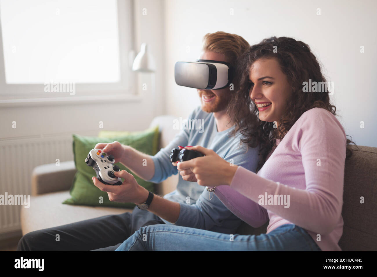 Couple playing games and loving VR as future tech Stock Photo - Alamy